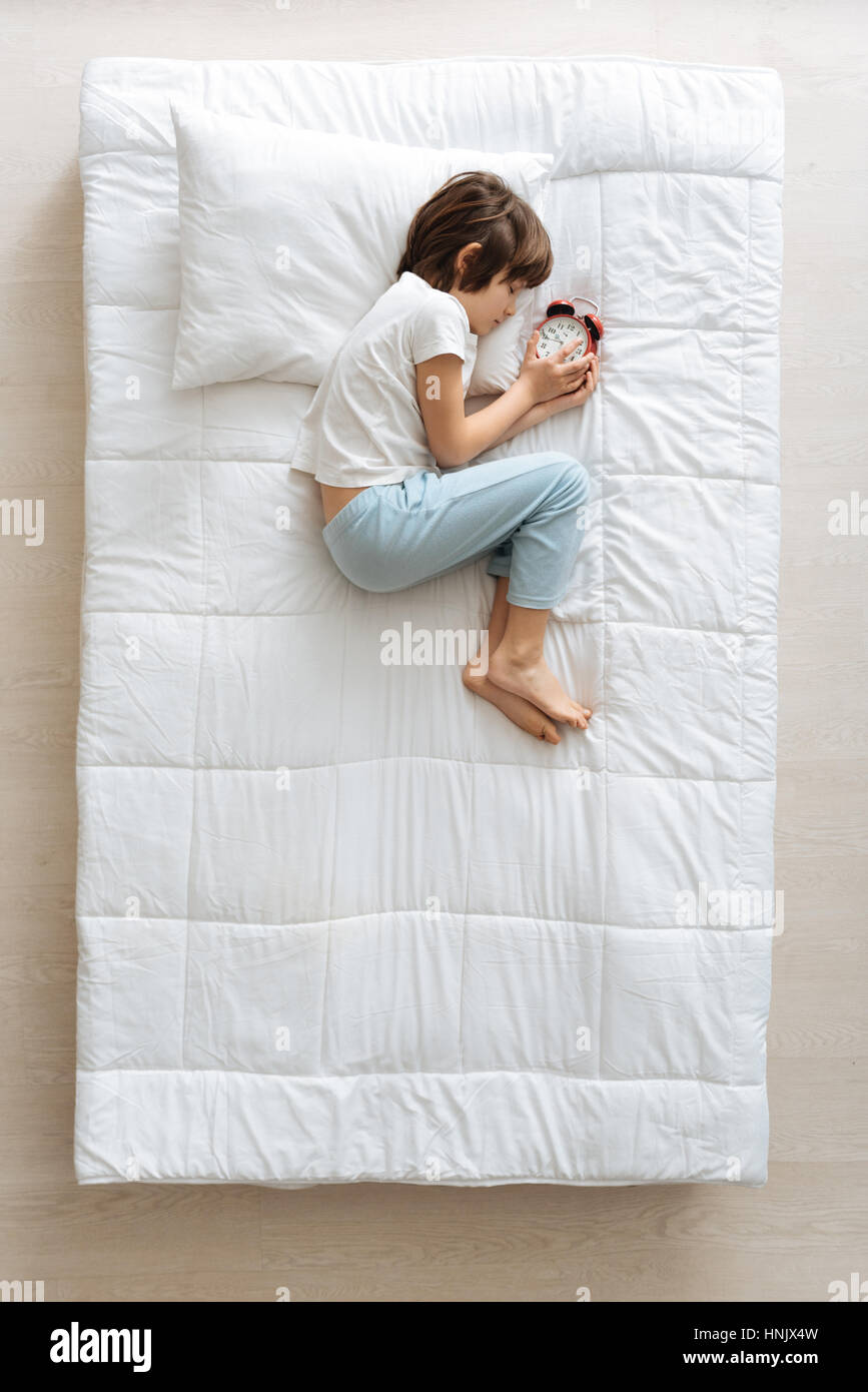 Calm nice kid waiting for the day to start Stock Photo - Alamy