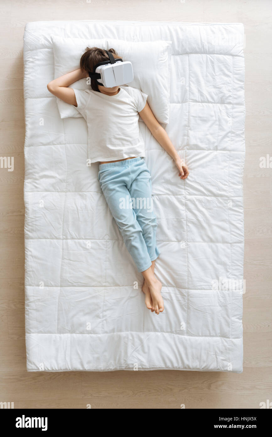Tech savvy boy enjoying a virtual reality trip Stock Photo - Alamy