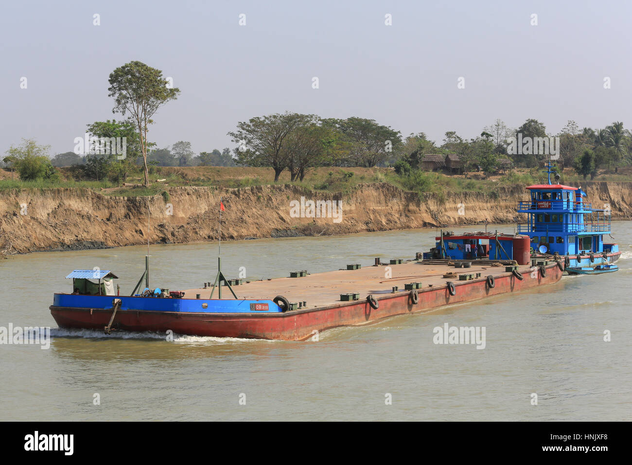 River tug pushing a barge on the Irrawaddy River in Myanmar (Burma ...