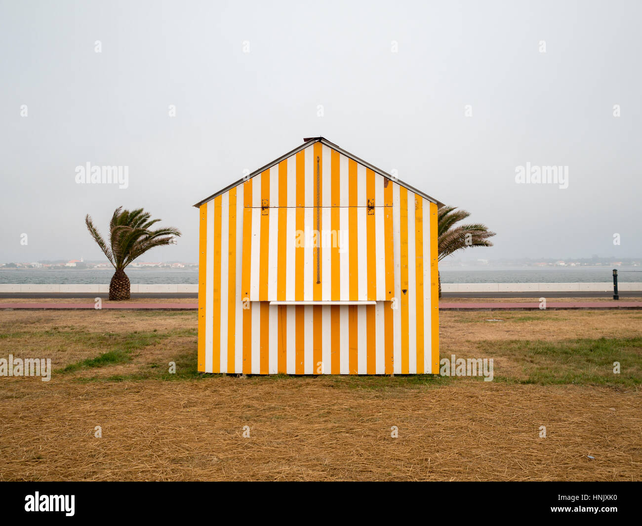 What and yellow stripped shack Stock Photo - Alamy