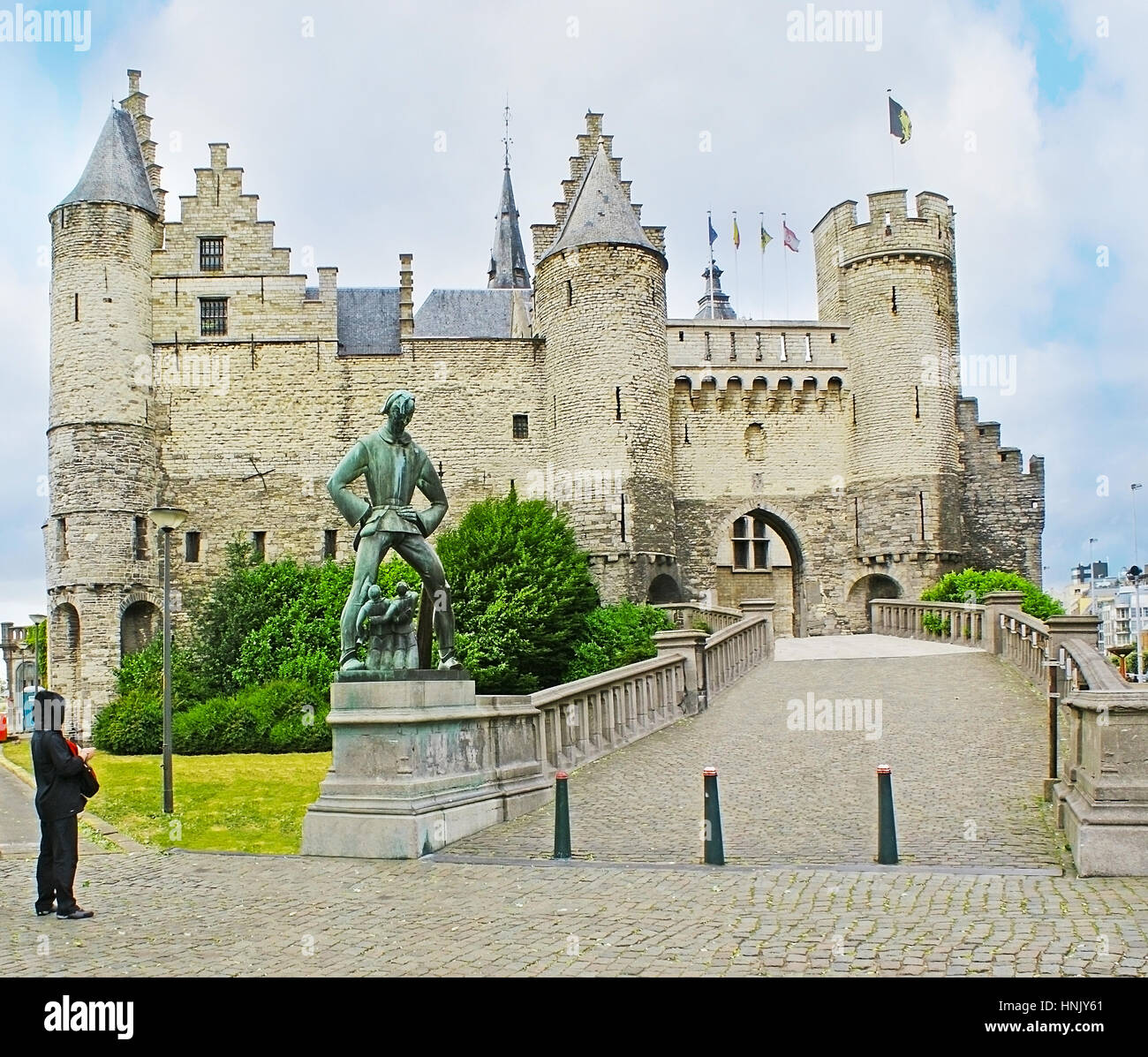 The medieval Het Steen Castle with the statue of giant Lange Wapper at ...