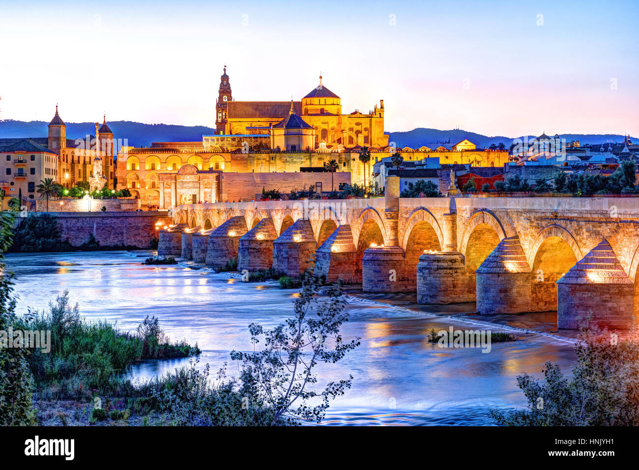Roman Bridge And Guadalquivir River Great Mosque Cordoba Spain Stock roman-bridge-and-guadalquivir-river-great-mosque-cordoba-spain-stock