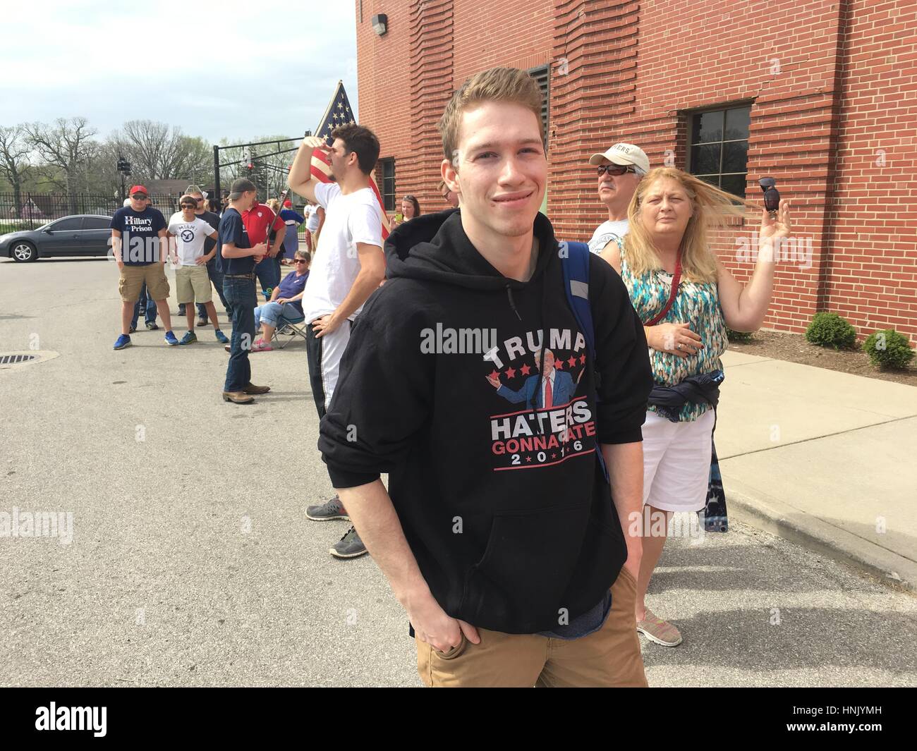 A Trump supporter waits in line before the presidential campaign rally ...