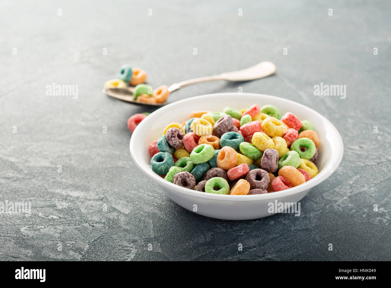 Fruit colorful sweet cereals in a bowl, traditional quick breakfast or ...