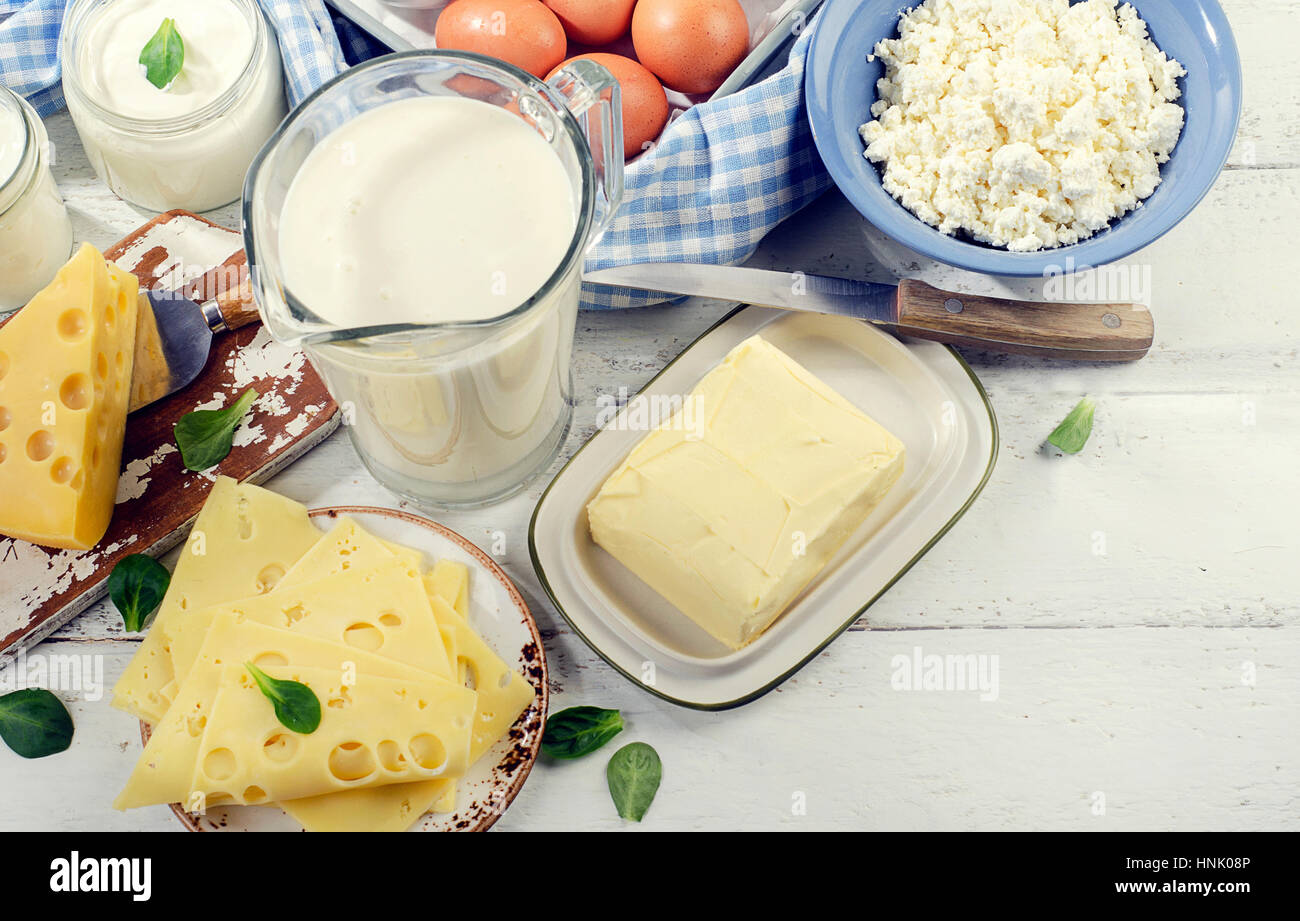 Set of fresh dairy products on white wooden table. Top view Stock Photo ...