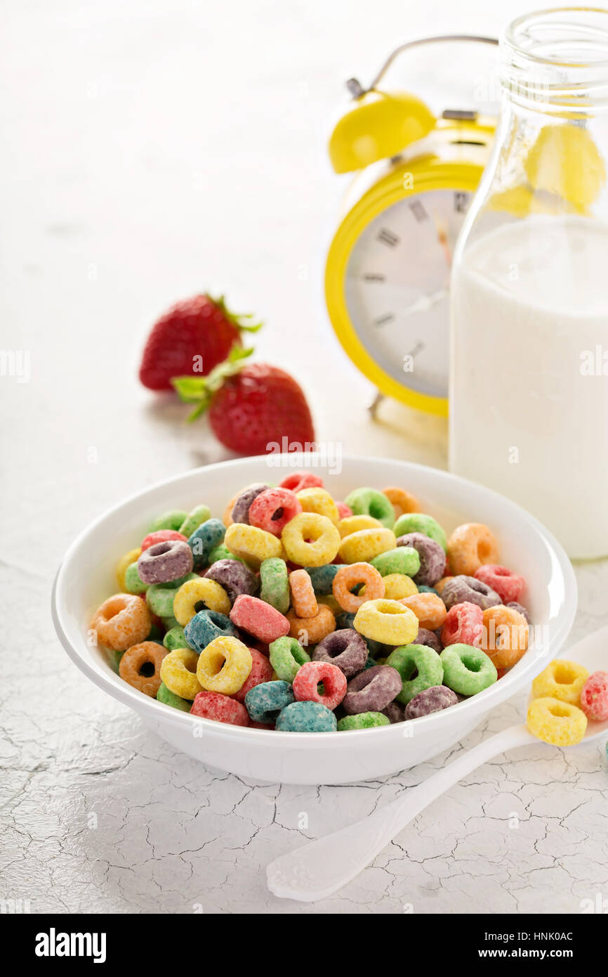 Fruit colorful sweet cereals in a bowl, traditional quick breakfast or ...