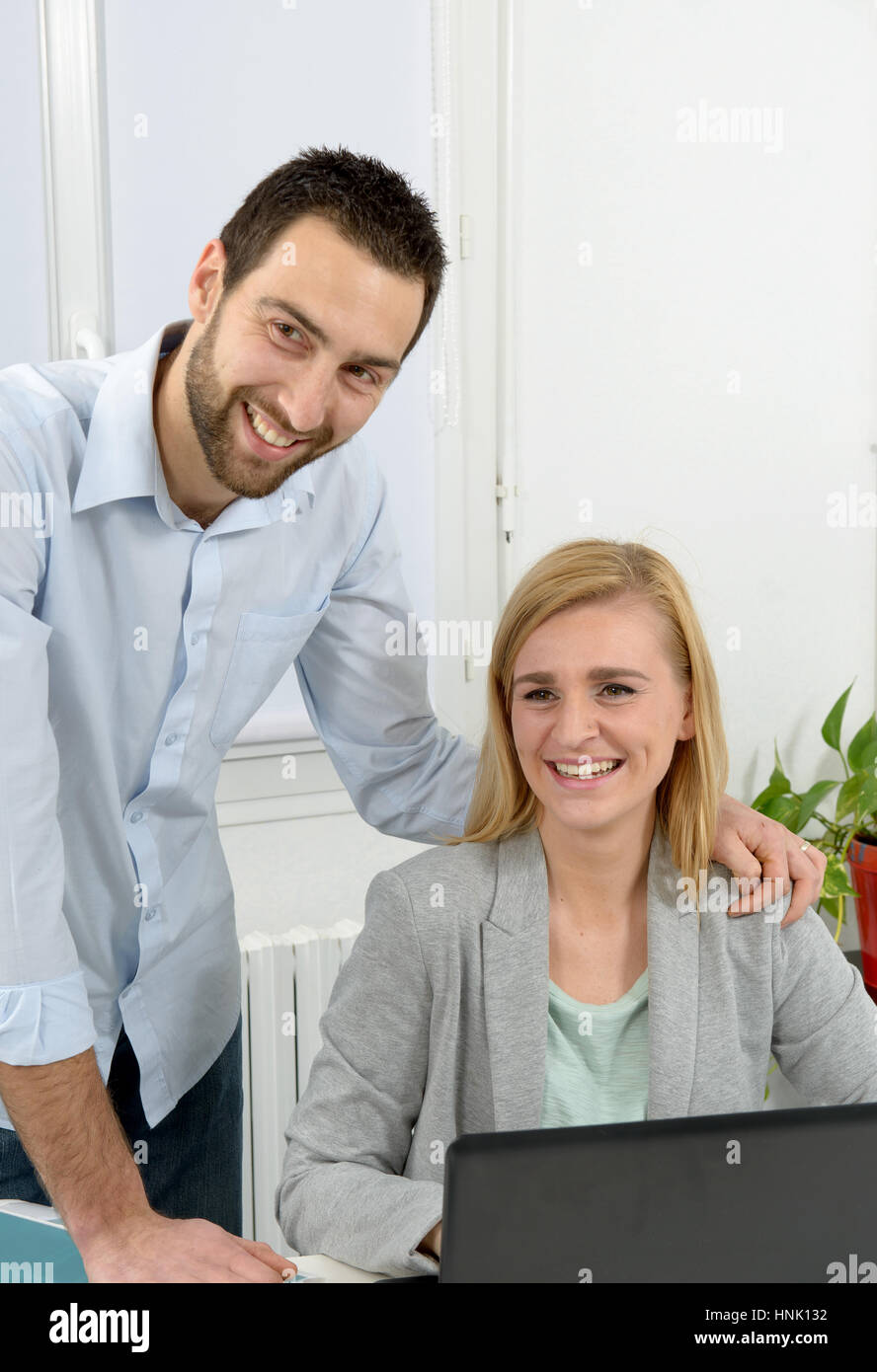 attractive man and beautiful woman business team at office Stock Photo ...