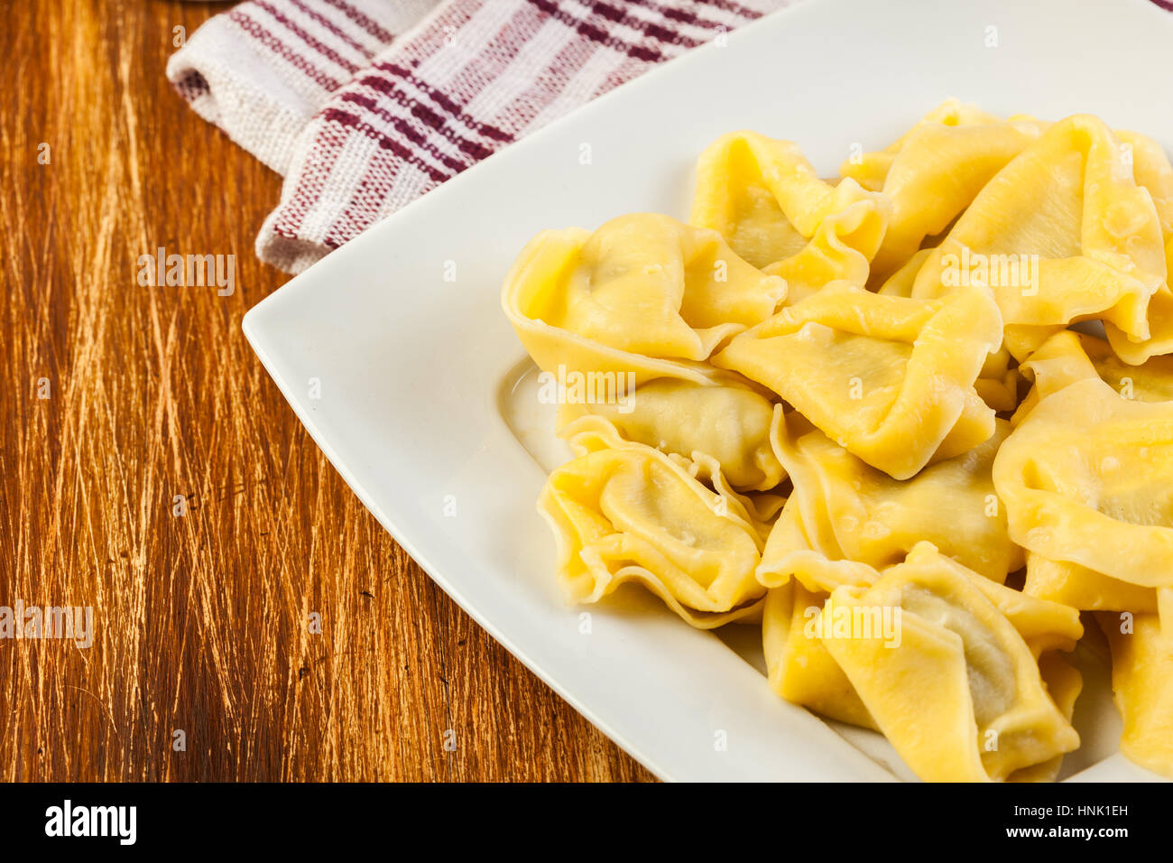 Tortellini shells filled with chesse Stock Photo - Alamy