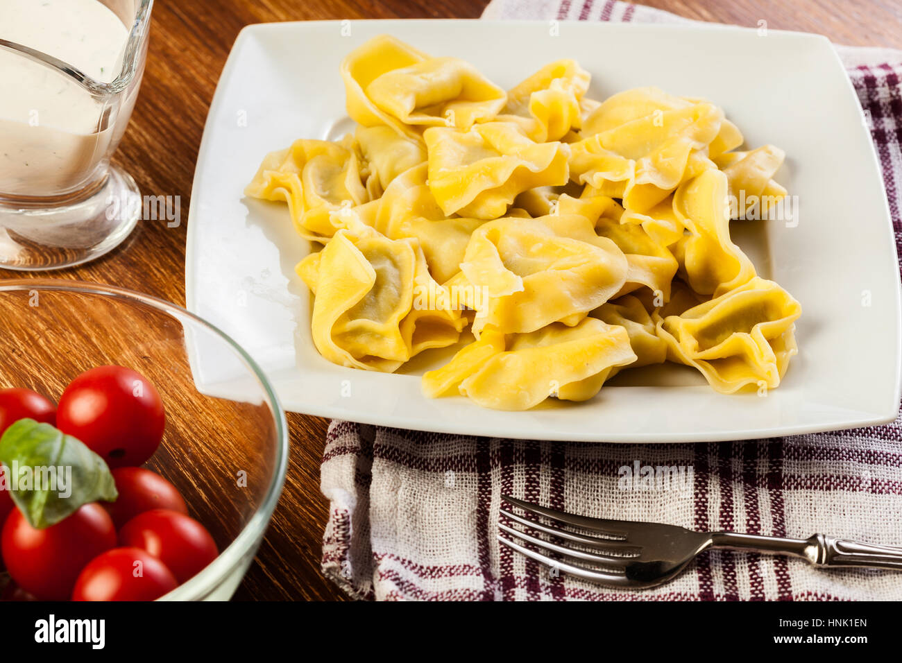 Tortellini shells filled with chesse Stock Photo - Alamy