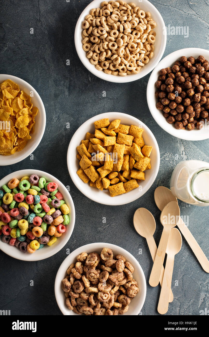 Variety of cold cereals in white bowls, quick breakfast for kids ...