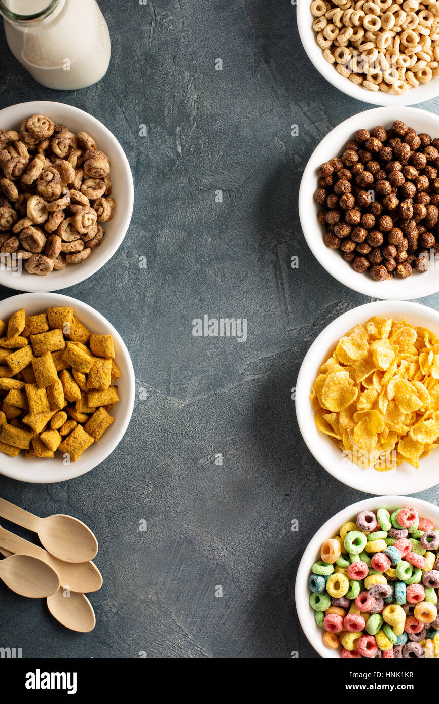 Variety of cold cereals in white bowls, quick breakfast for kids ...