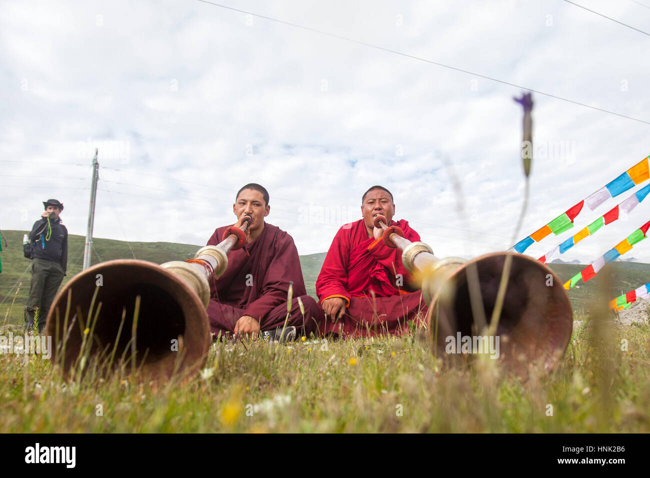Tibetan Buddhist monks play traditional instruments to bless the horse ...