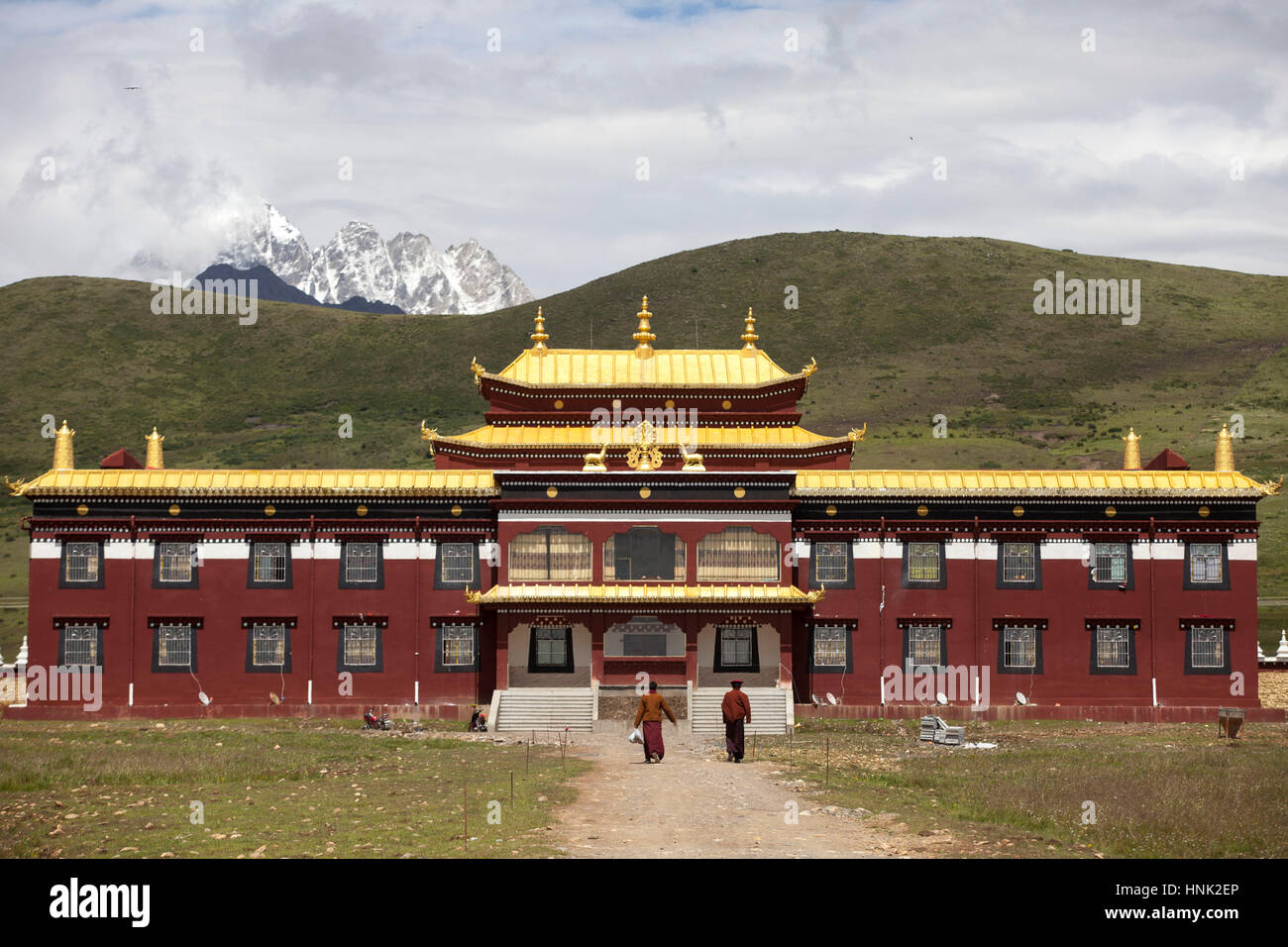 Buildings of Lhakang Tibetan Buddhist Monastery can be seen surrounded ...
