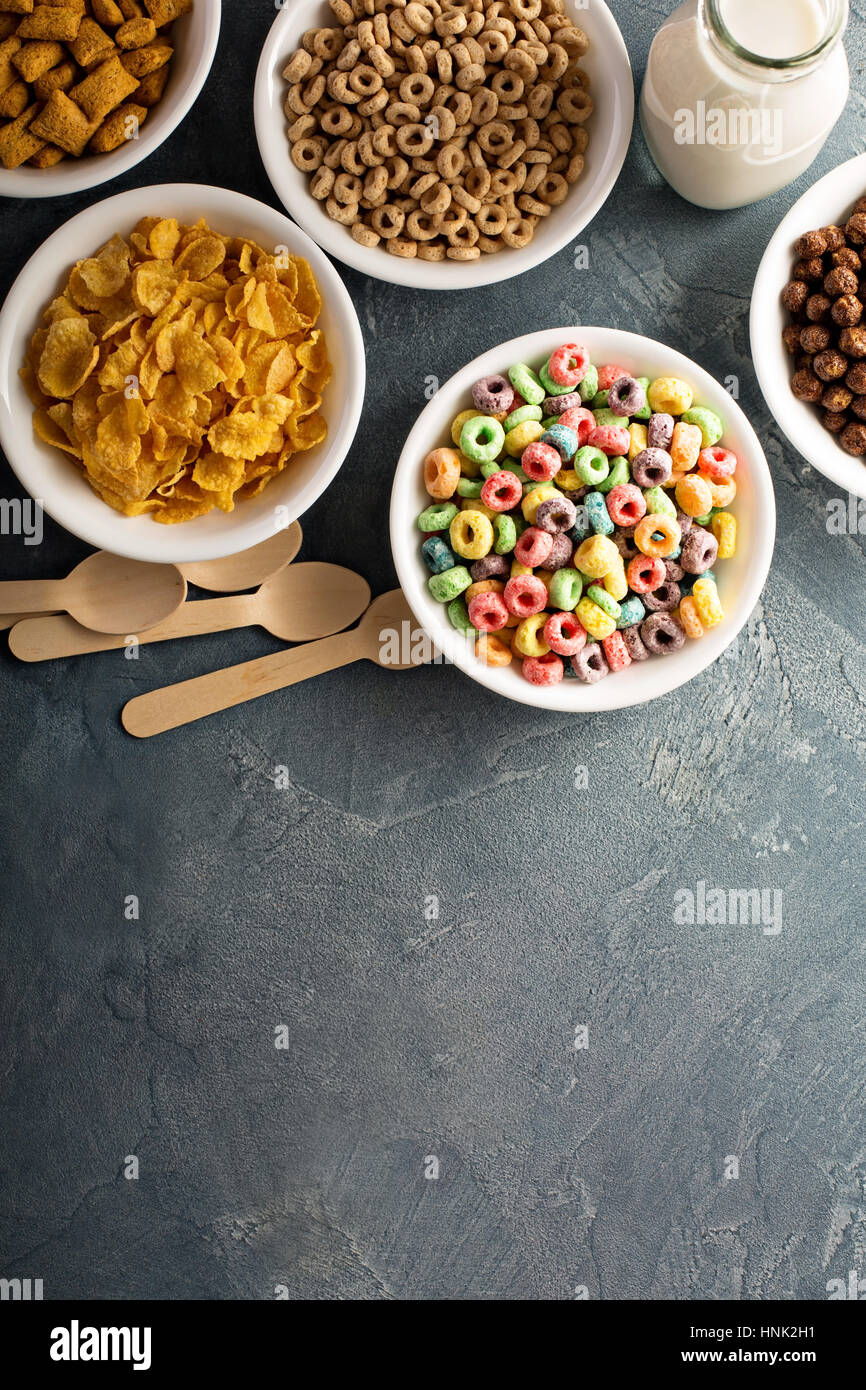 Variety of cold cereals in white bowls, quick breakfast for kids ...