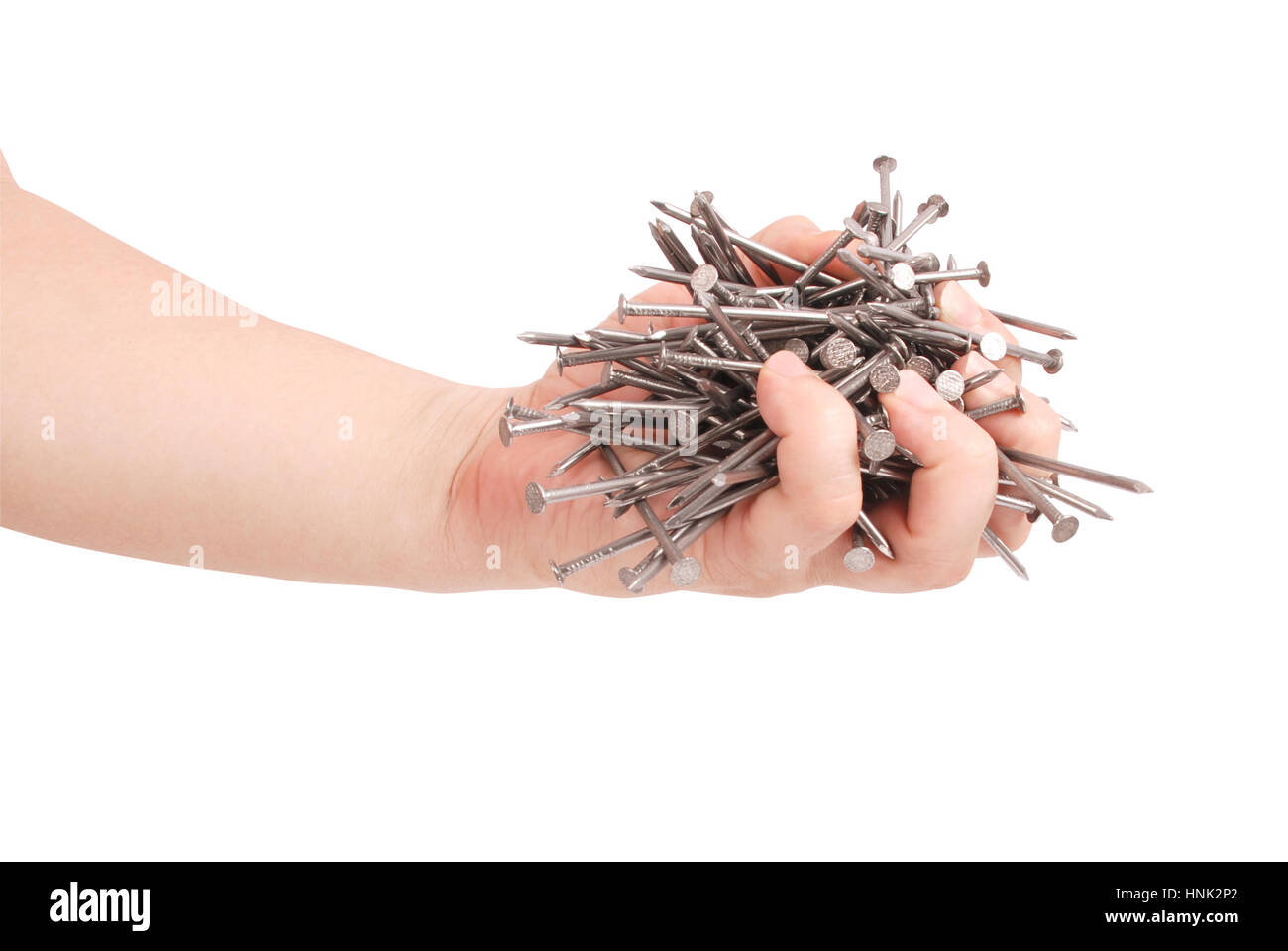 Man's hand holding metal nails. Closeup with clipping path isolated on ...