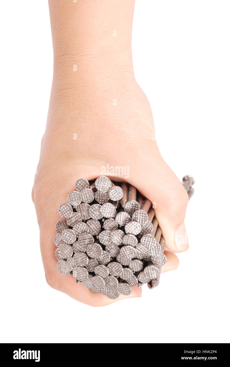 Man's hand holding metal nails. Closeup with clipping path isolated on ...