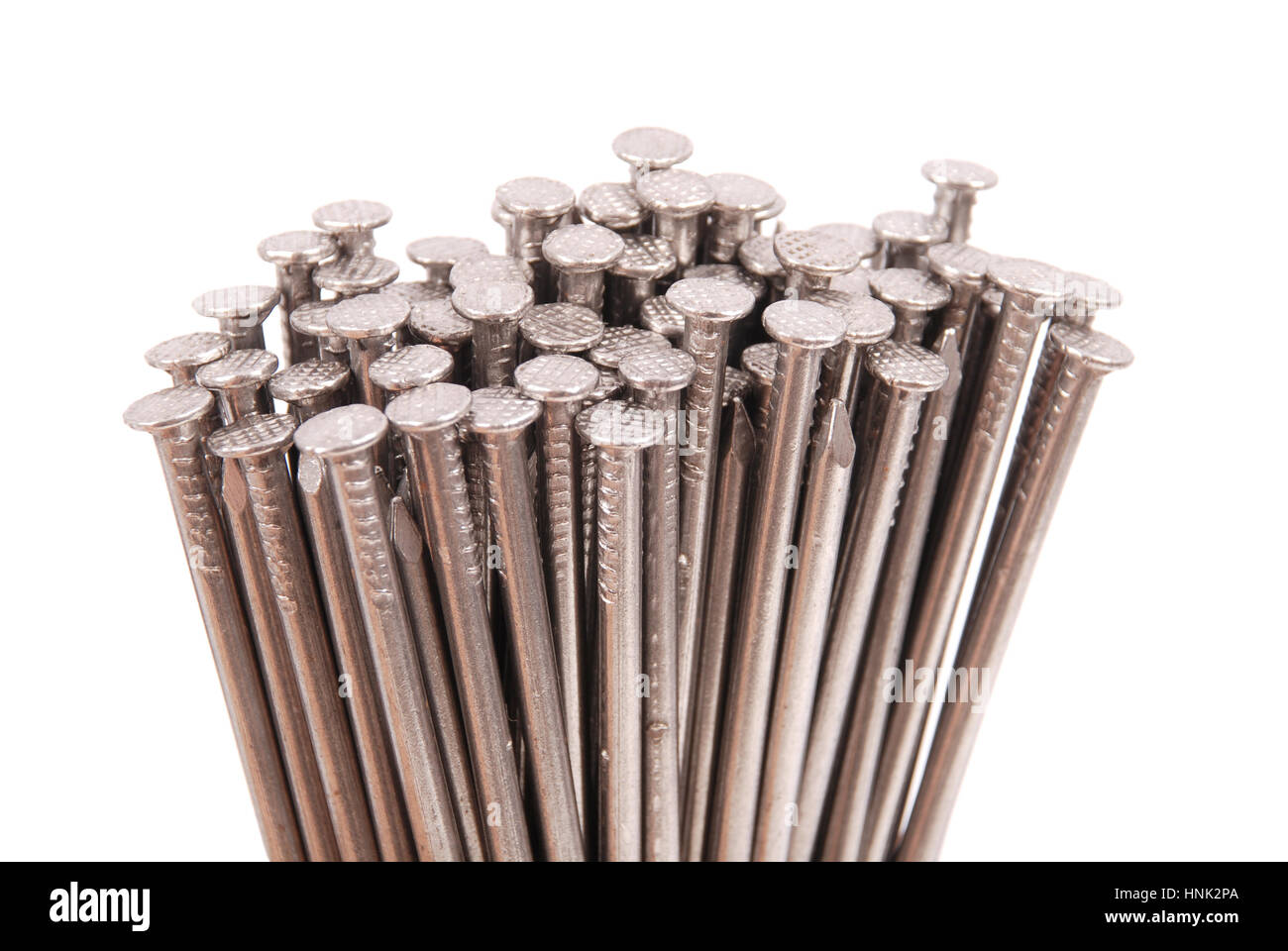 New metal nails isolated on white background Stock Photo - Alamy