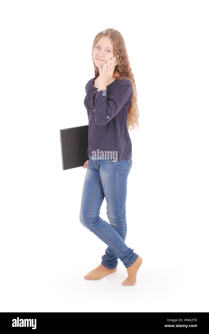 Student teenage girl lying sideways on the floor with laptop and ...