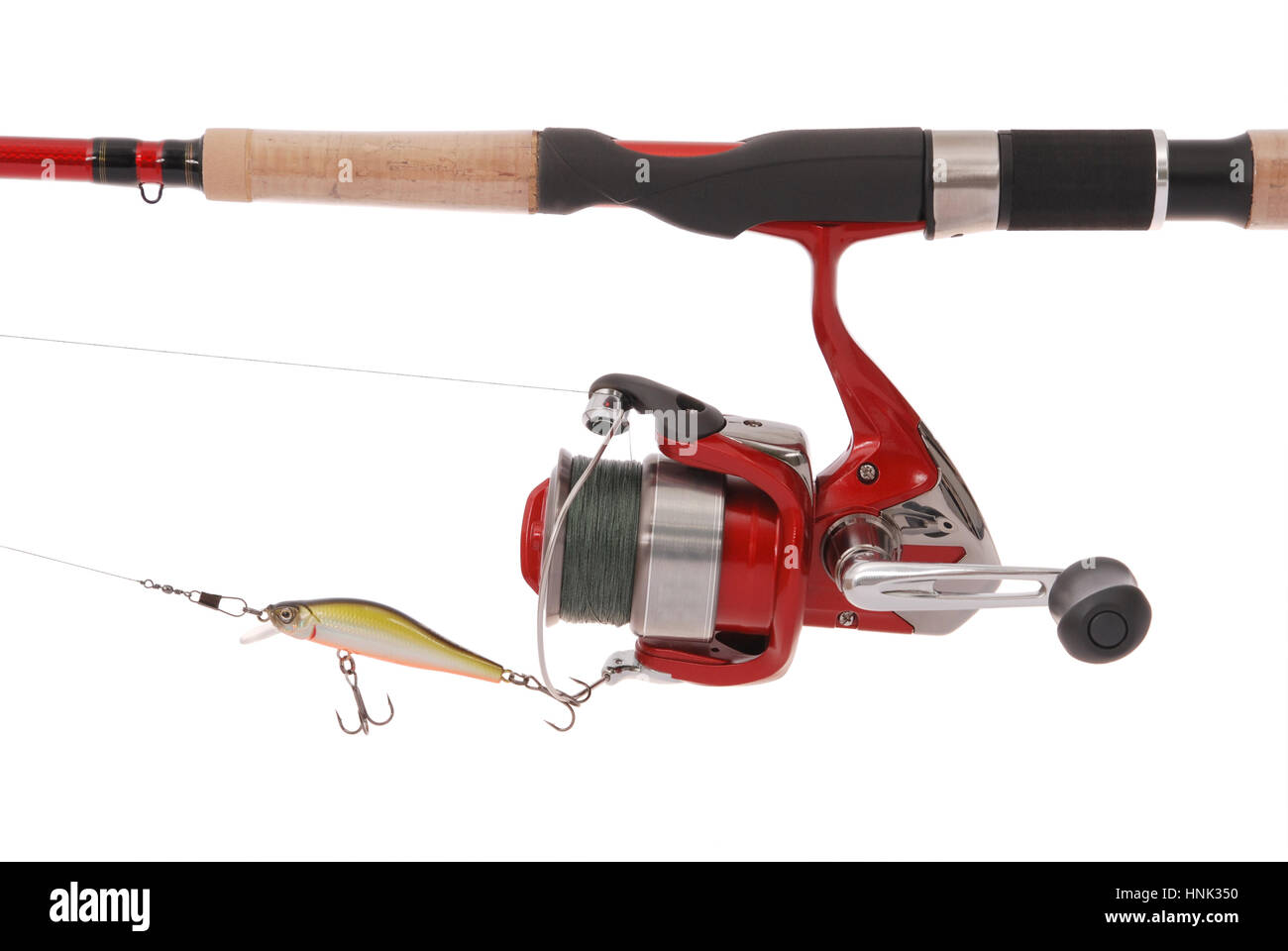 Fishing rod with a reel isolated on white background Stock Photo - Alamy