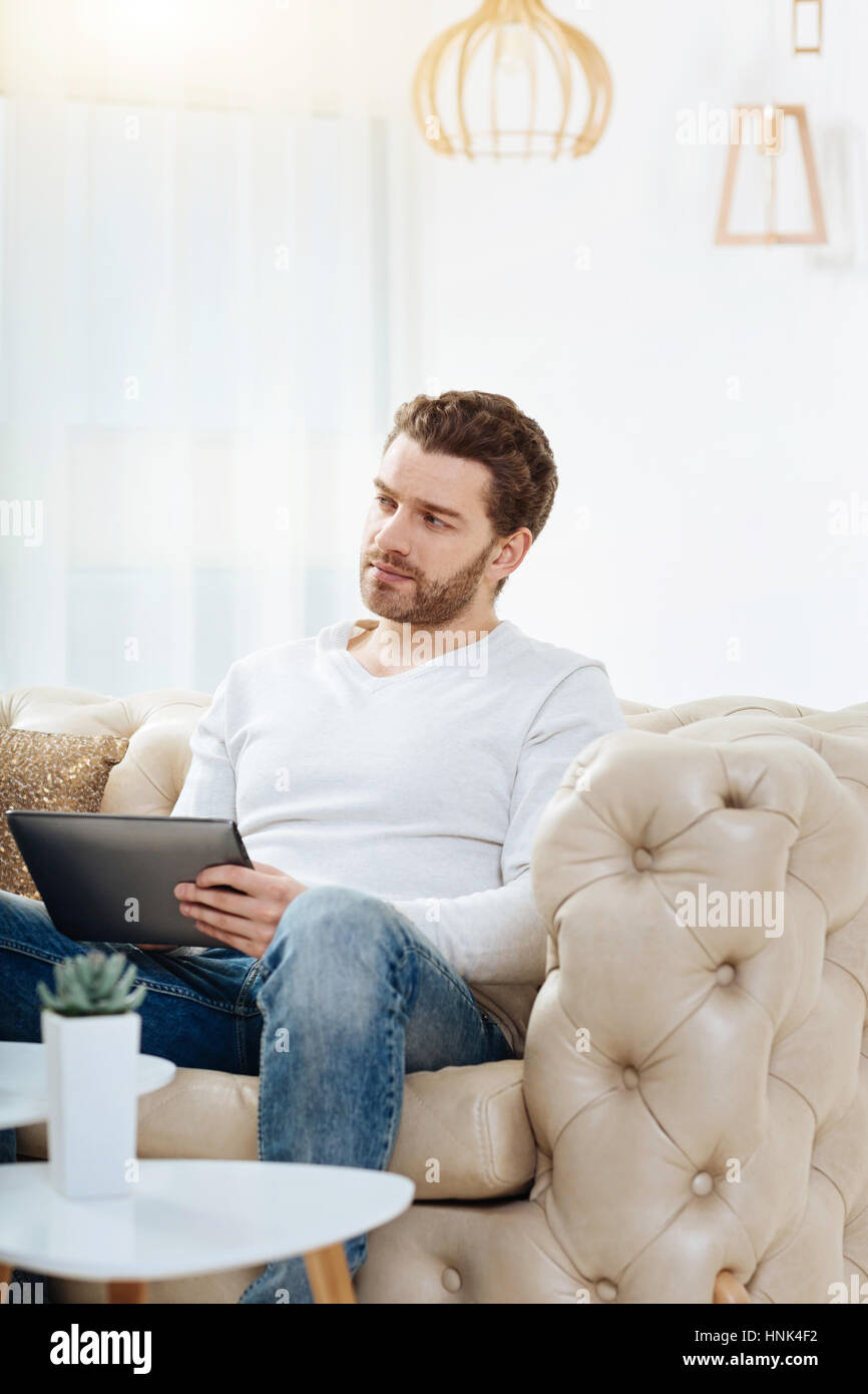 Confident self employed man sitting in his office Stock Photo - Alamy
