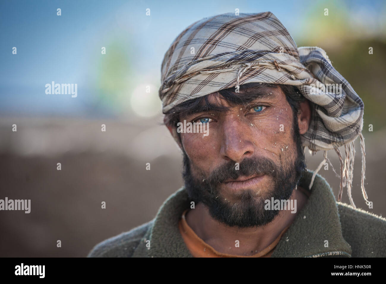 Afghanistan, Wahkan corridor, a portrait of a man with blue eyes and ...