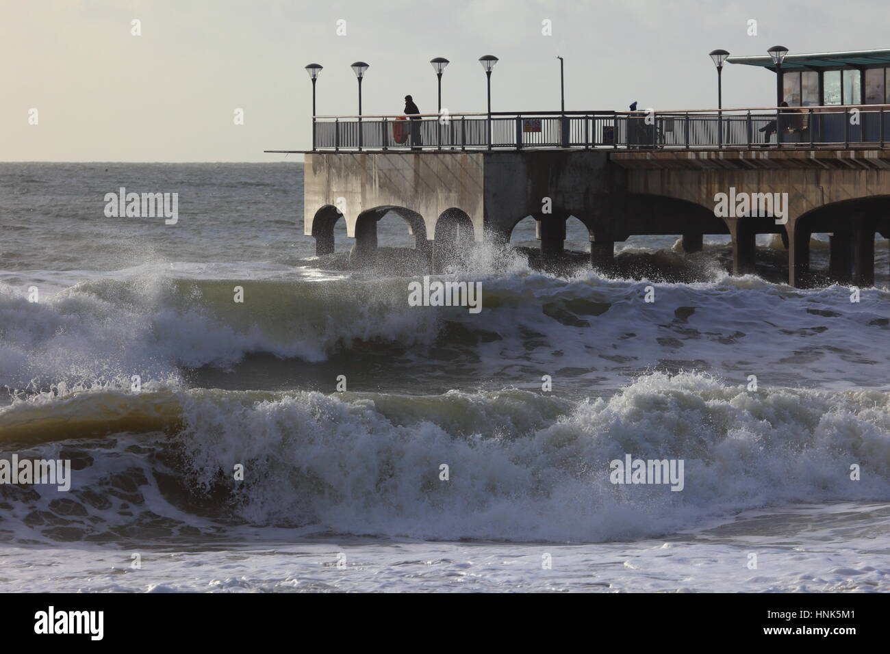 Large swell and waves pounding on the shore at Boscombe pier ...