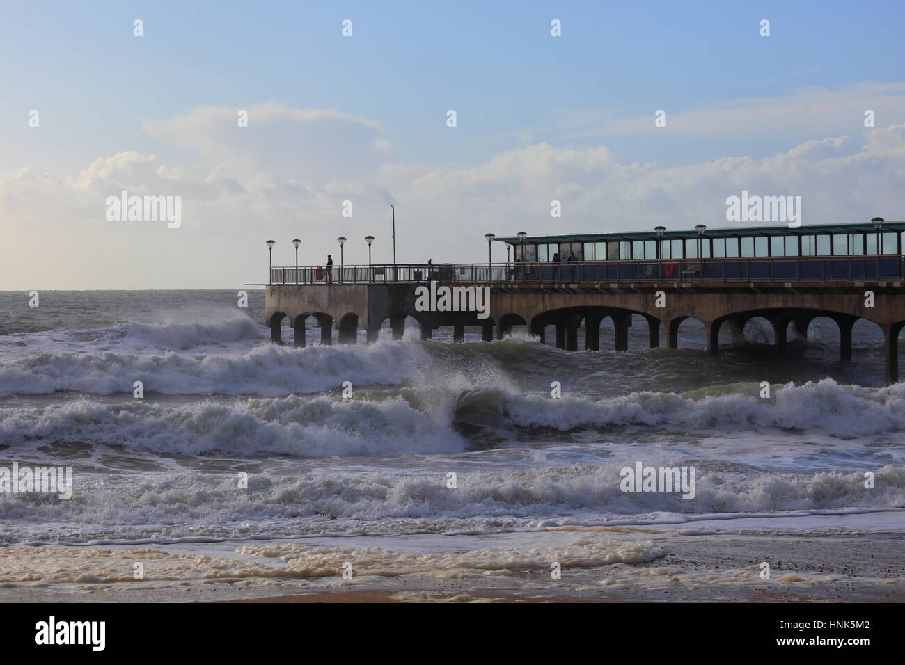 Large swell and waves pounding on the shore at Boscombe pier ...