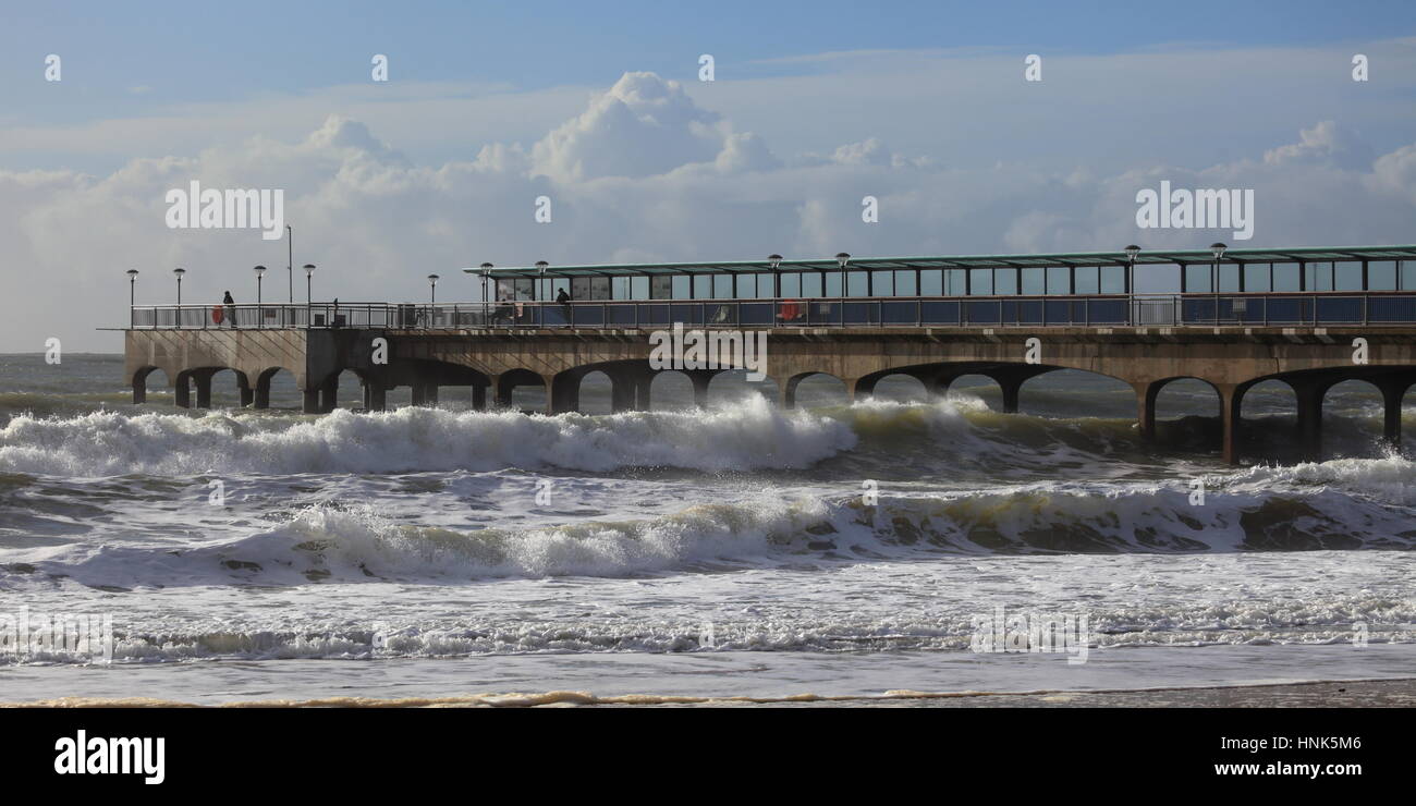 Large swell and waves pounding on the shore at Boscombe pier ...