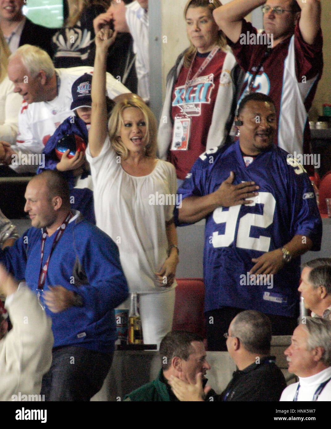 Pamela Anderson celebrates after the New York Giants score against the ...