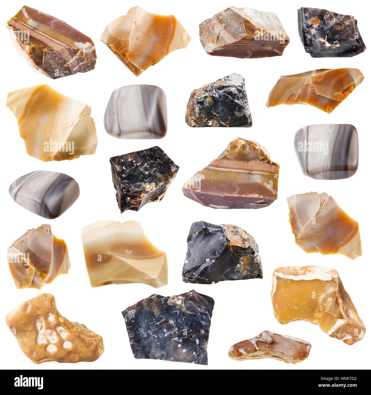 collection of tumbled and raw flint mineral stones isolated on white ...