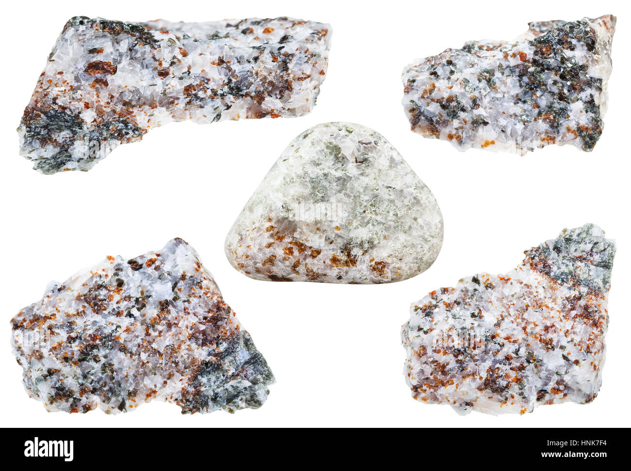 collection of raw and tumbled calcite stones with brown chondrodite and ...