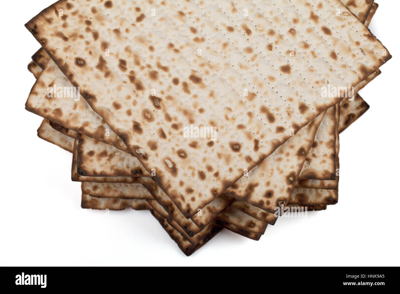 Traditional Jewish matzah on a white background. Close-up Stock Photo ...