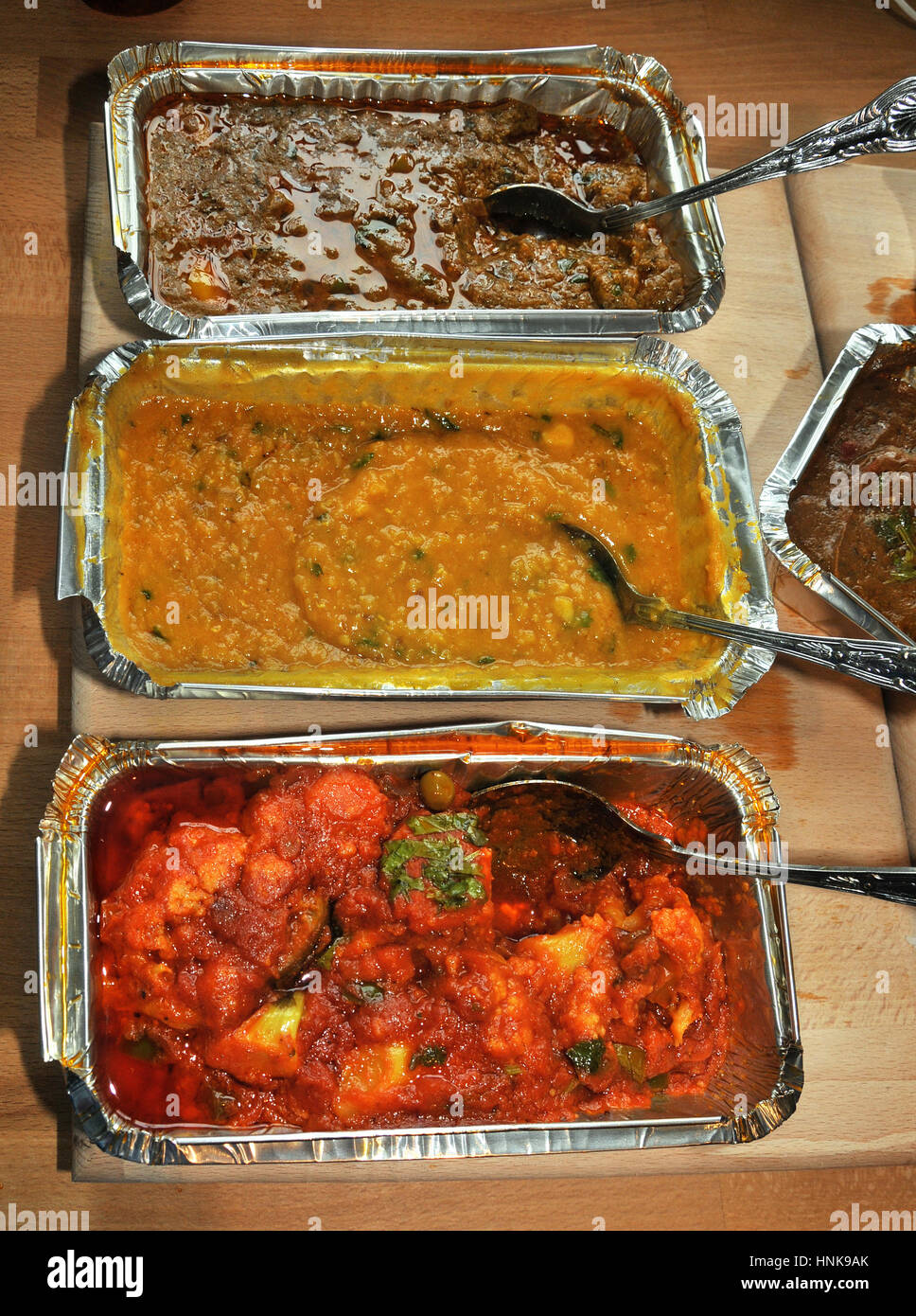 A selection of Indian carryout curries ready to serve Stock Photo - Alamy