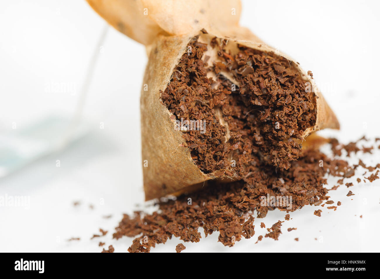 tea leaves inside the used tea bag on white background Stock Photo - Alamy