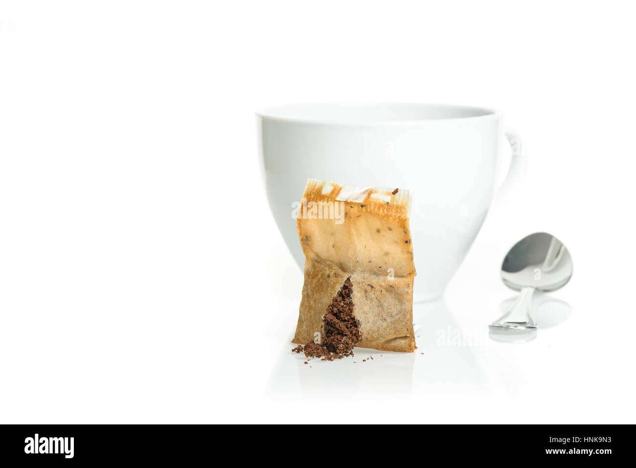 tea leaves inside the used tea bag on white background Stock Photo - Alamy