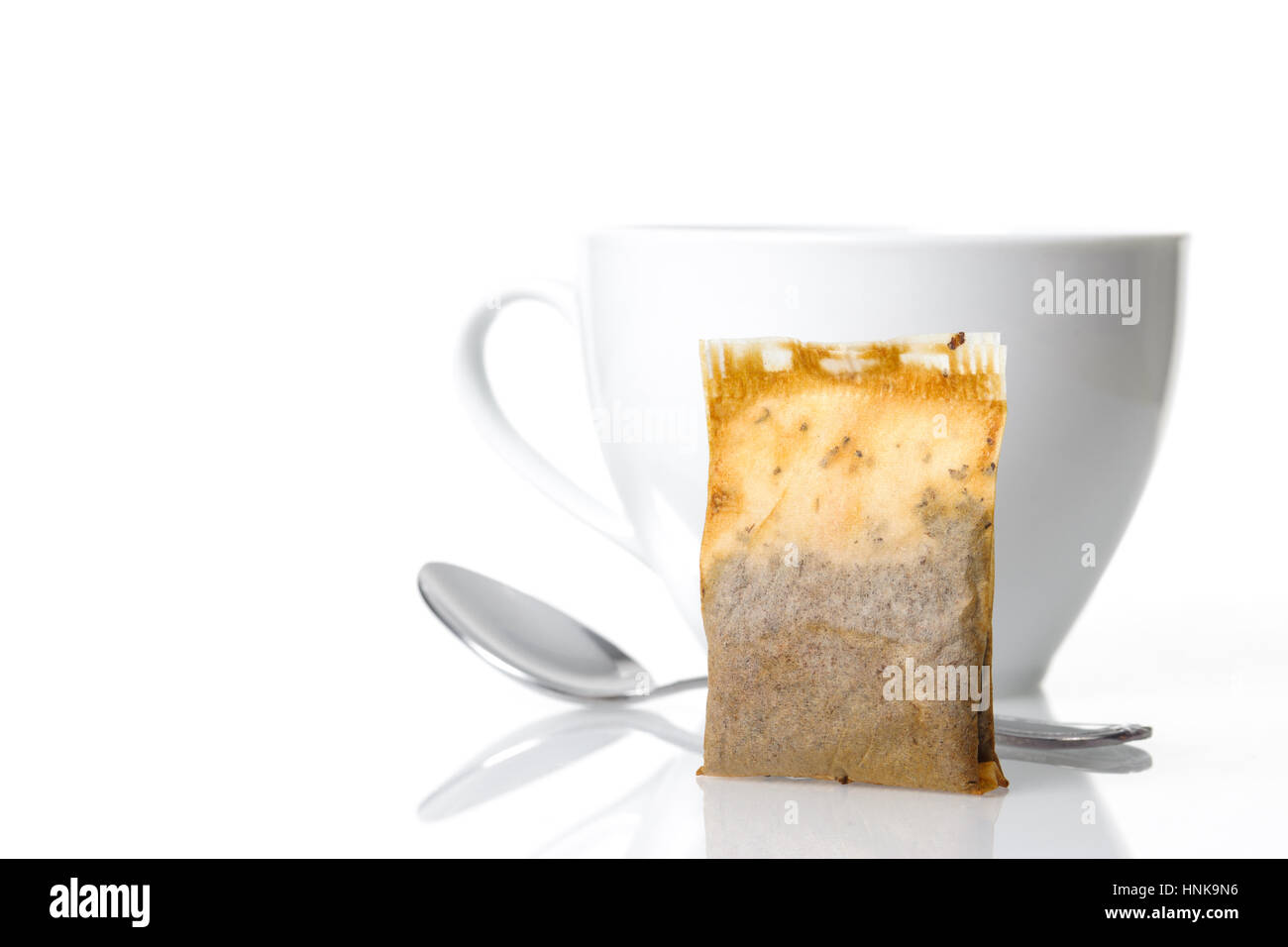tea leaves inside the used tea bag on white background Stock Photo - Alamy