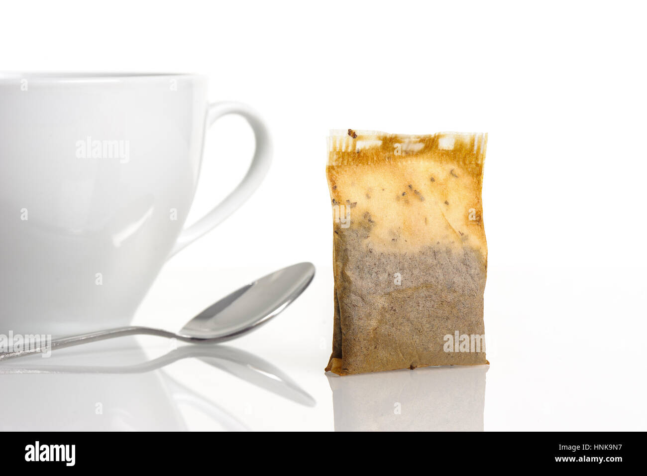 tea leaves inside the used tea bag on white background Stock Photo - Alamy