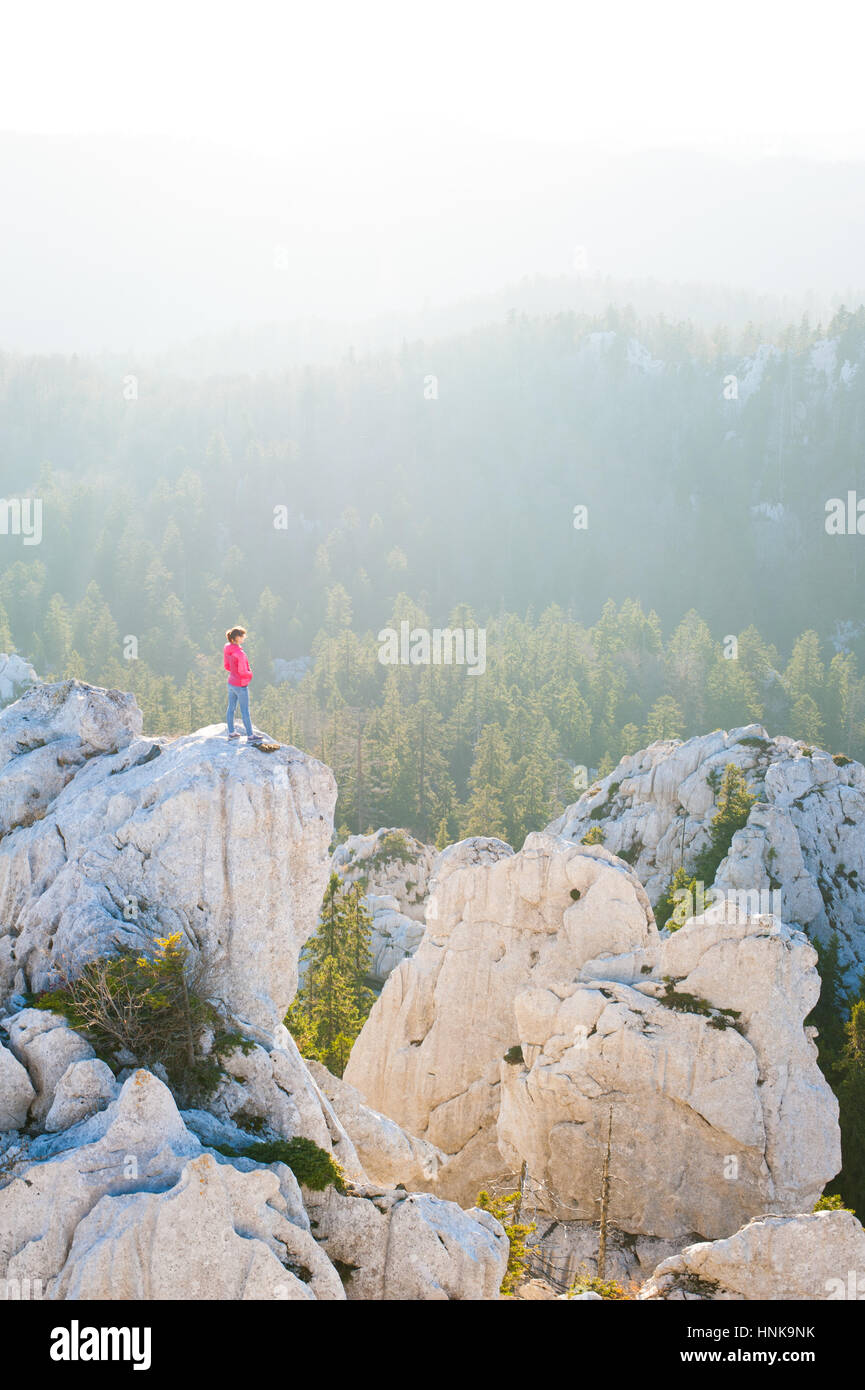 Standing on the edge of a cliff. Bijele Stijene, Croatia Stock Photo ...