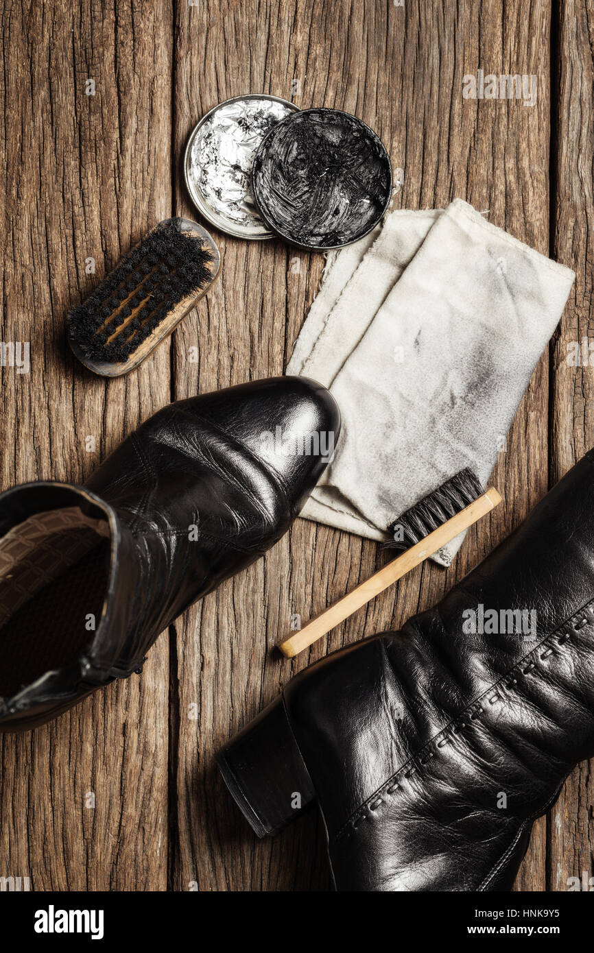 black leather boots with shoe maintenance set Stock Photo - Alamy