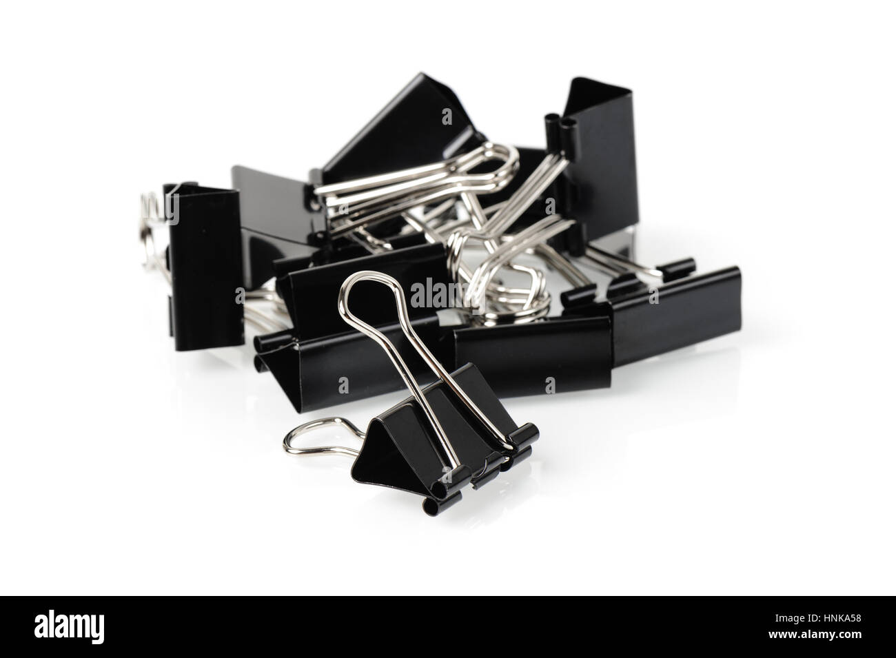 black binder clips isolated on white background Stock Photo - Alamy