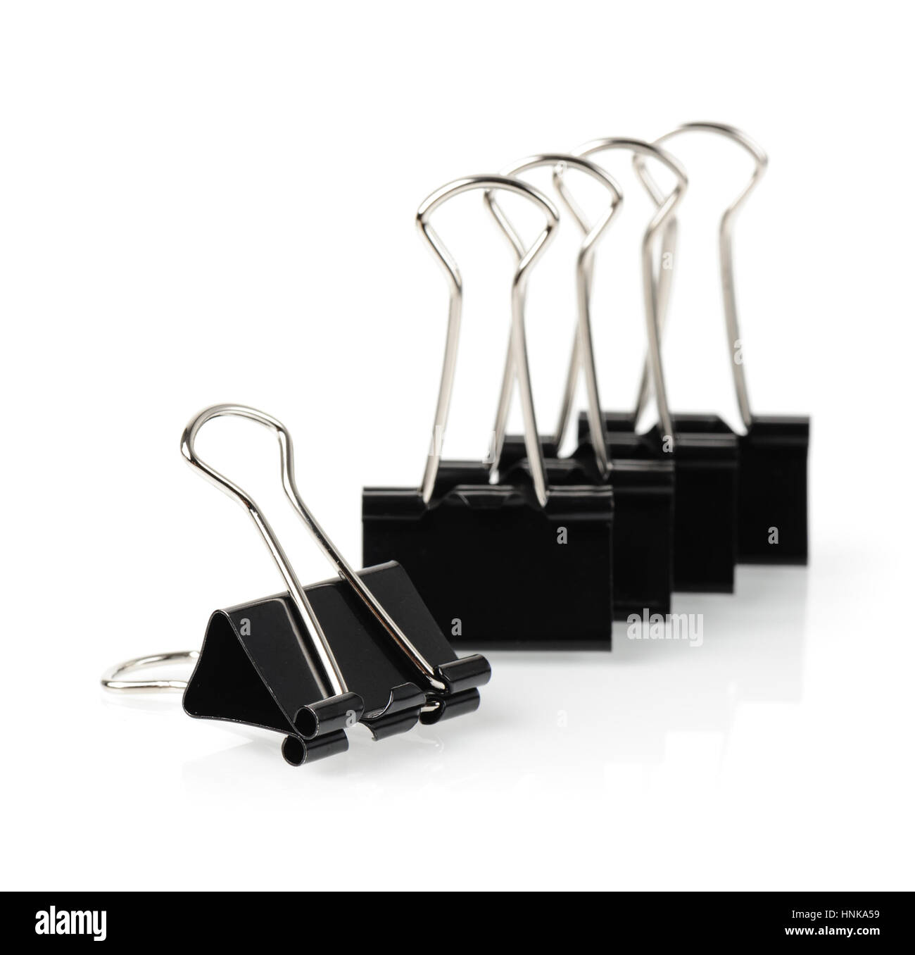 black binder clips isolated on white background Stock Photo - Alamy