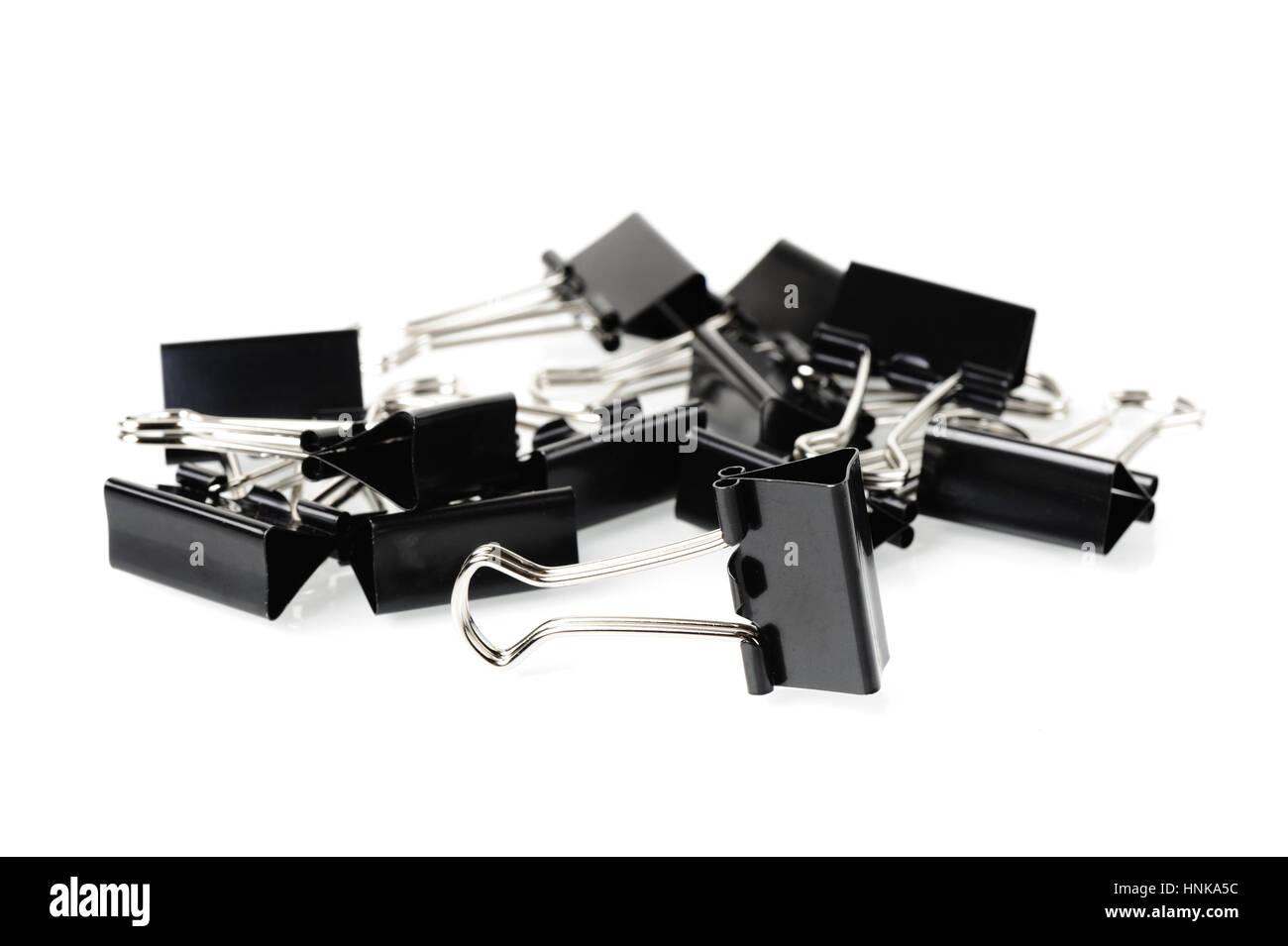 black binder clips isolated on white background Stock Photo - Alamy