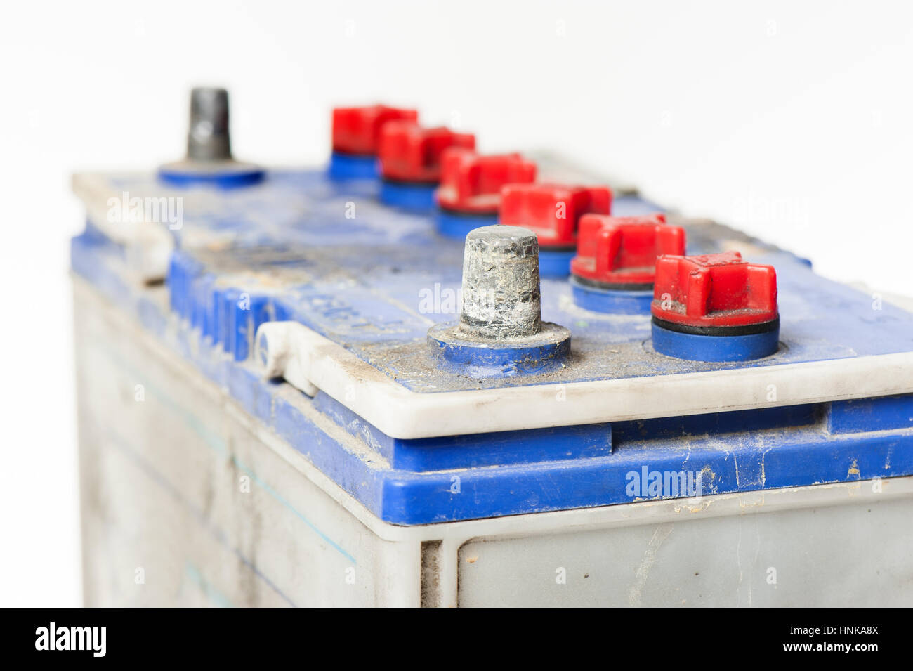 closeup old car battery on white background Stock Photo - Alamy
