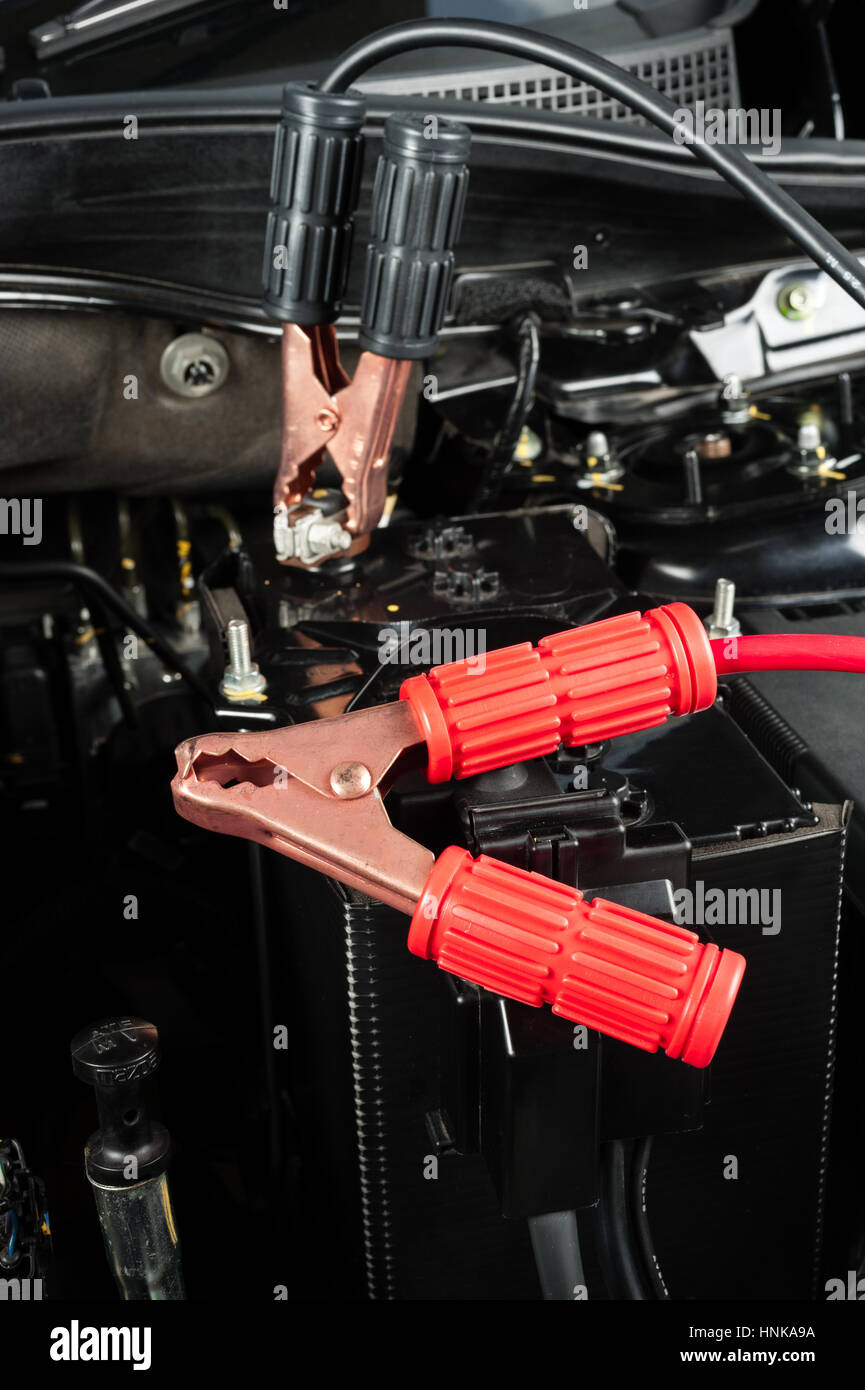 jumper cable for car battery in engine room Stock Photo - Alamy