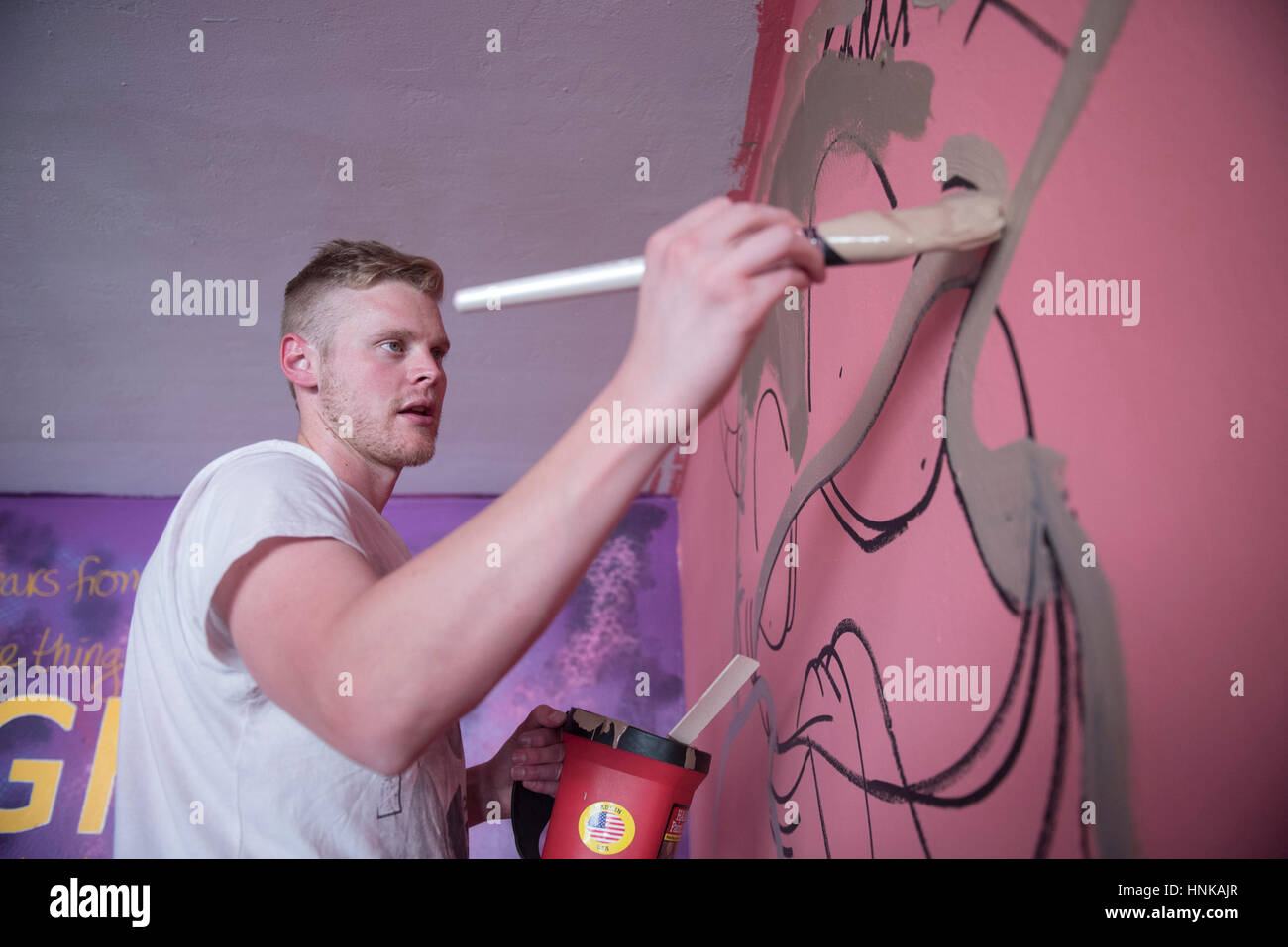 Artist Ryan Brunty paints a mural in Las Vegas on Sept. 20, 2015 Stock ...