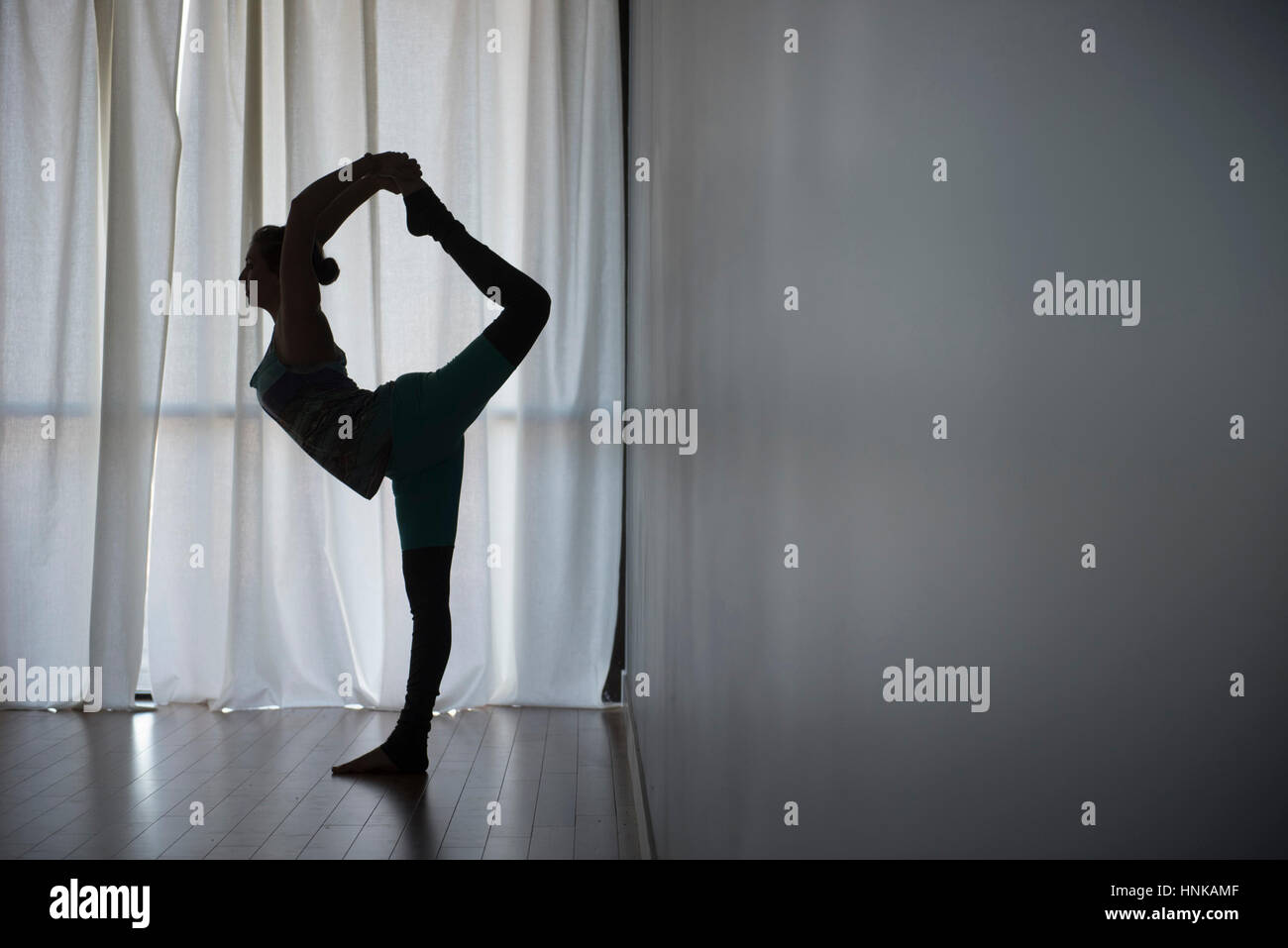 Ashley Cottrell, co-owner of Evolution Yoga, demonstrates yoga poses in ...