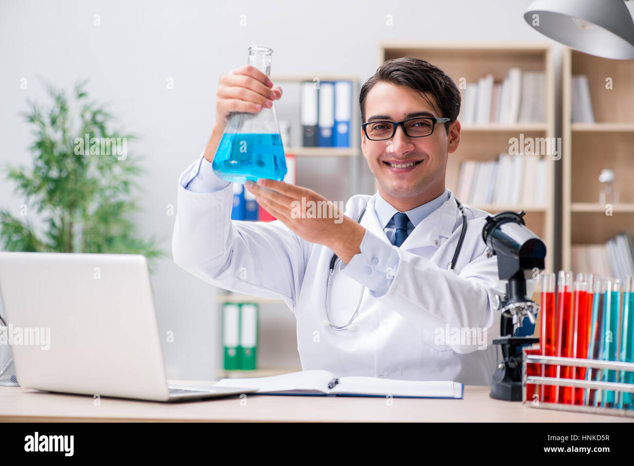 Man doctor working in the lab Stock Photo - Alamy