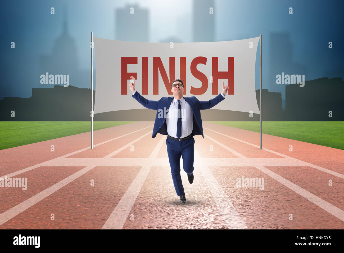 Businessman on the finishing line in competition concept Stock Photo ...