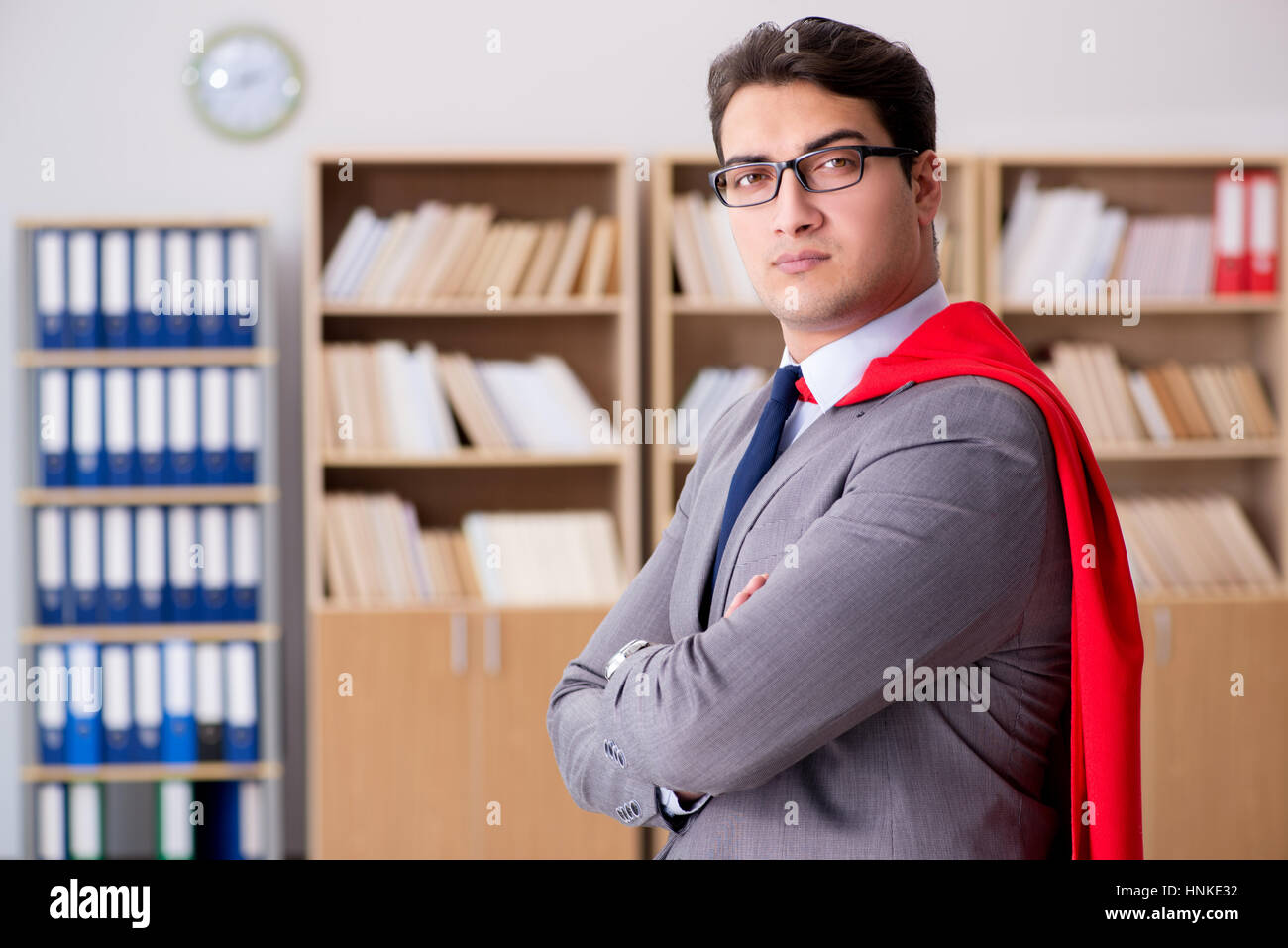 Superhero businessman working in the office Stock Photo - Alamy