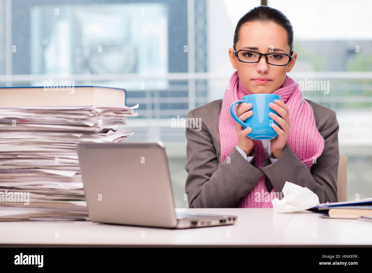 Young businesswoman sick in the office Stock Photo - Alamy